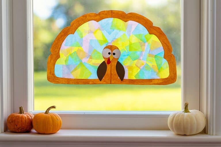 Happy Pumpkin Suncatcher Craft for Kids To Brighten Fall Windows